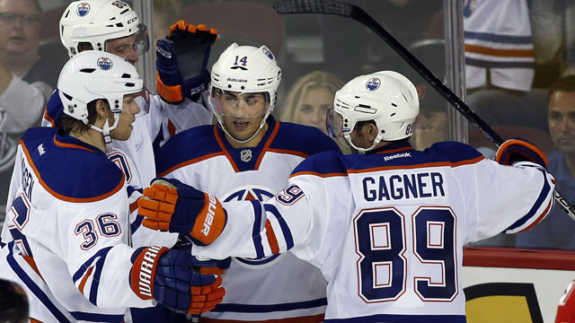 Oilers, Flames each win in split-squad games