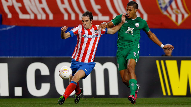 Atletico signs Godin to three-year extension