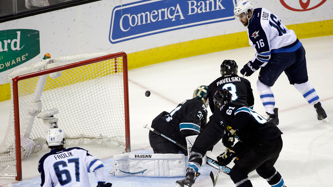 Enstrom’s late goal helps Jets defeat Sharks