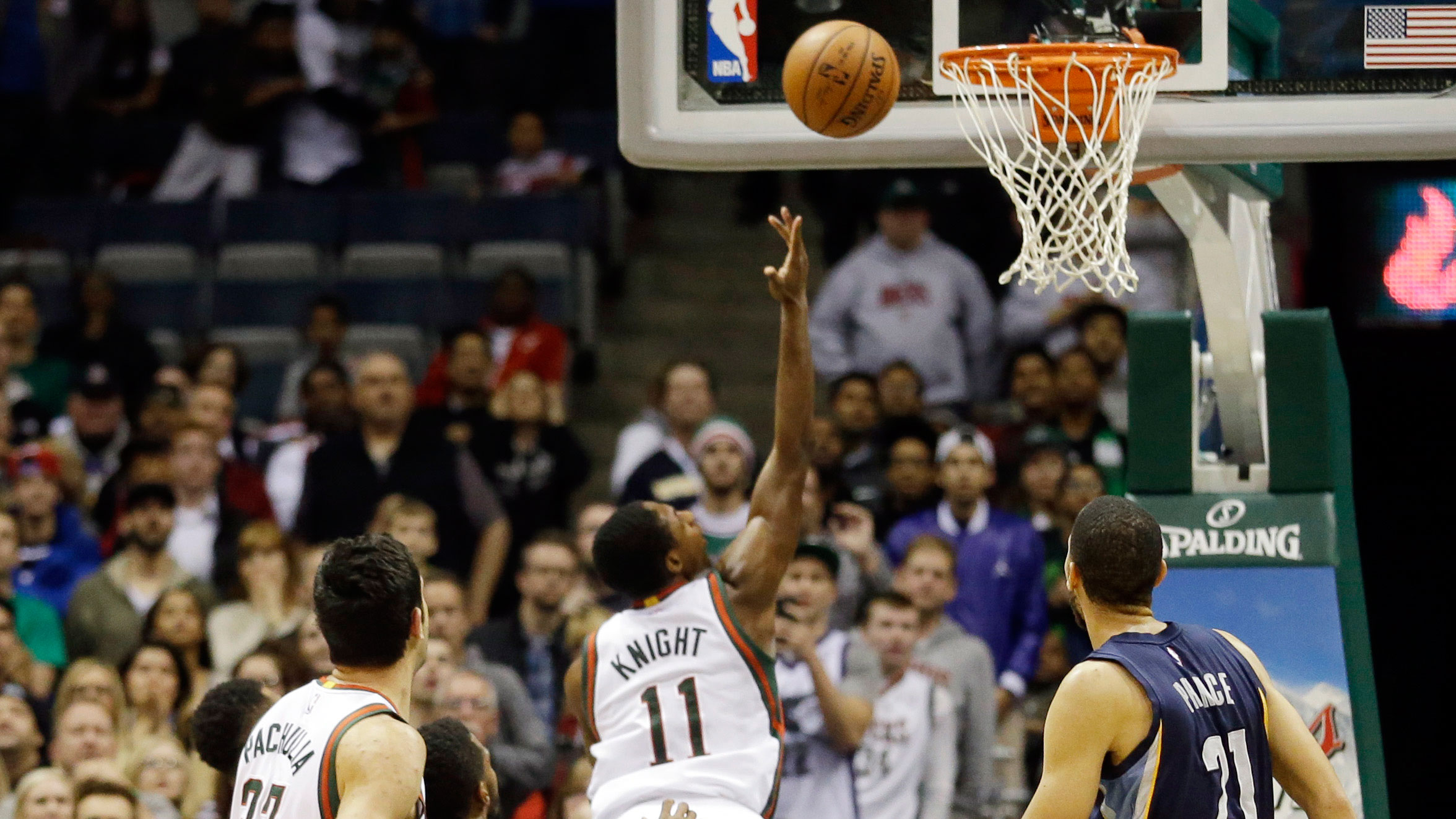 Knight’s late 3-point play carries Bucks to win