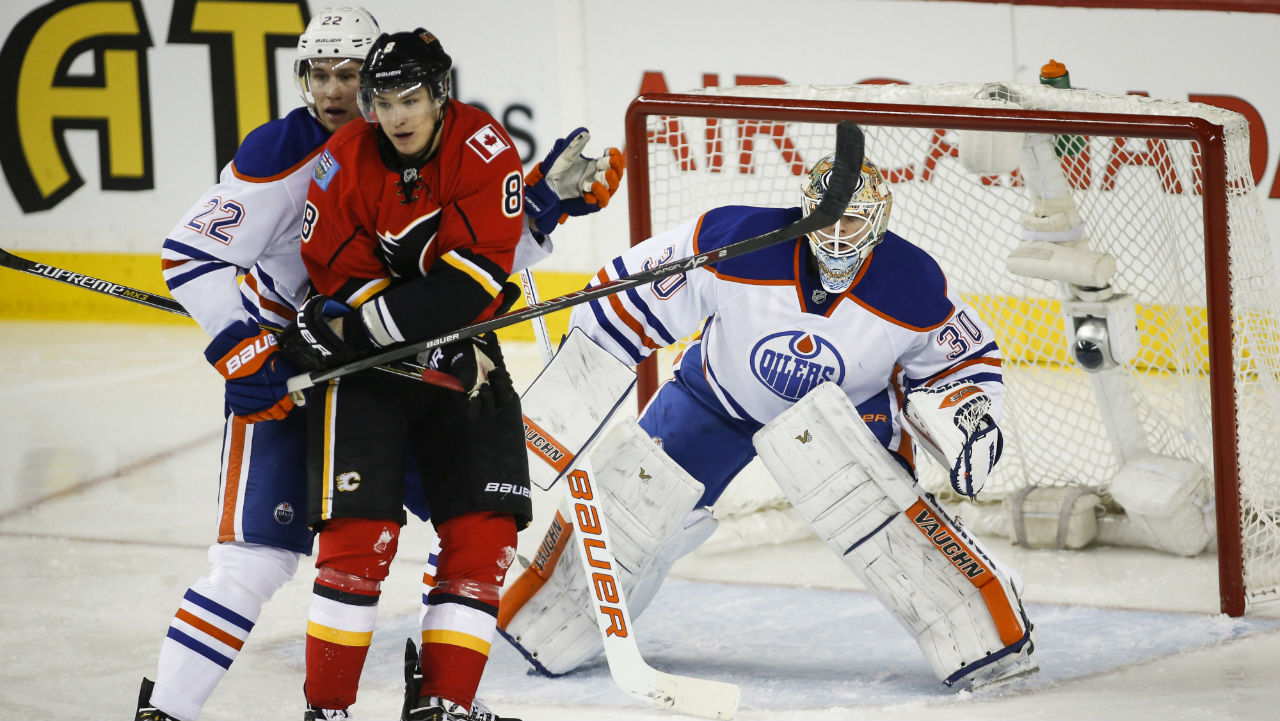 Flames score four in third to top Oilers