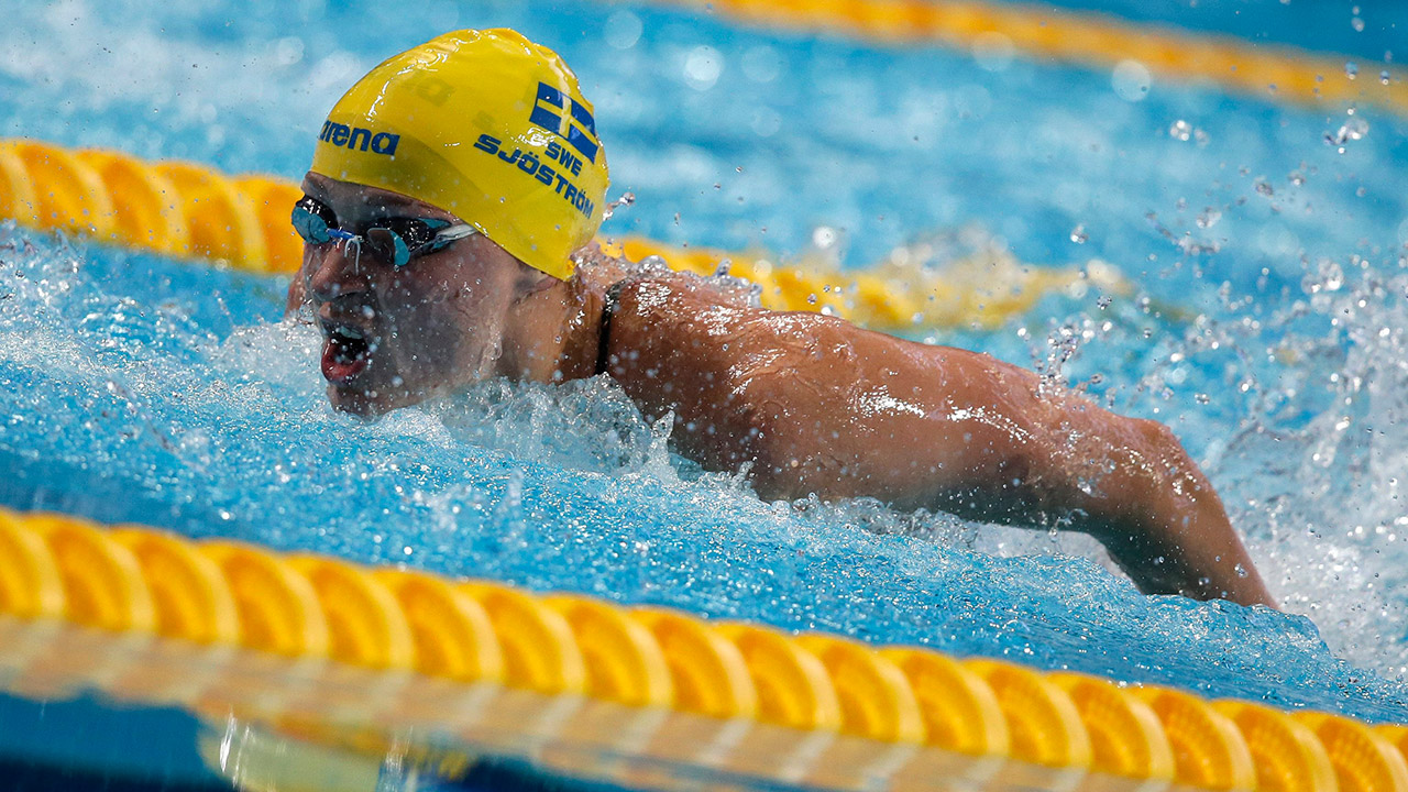 Sjostrom wins 100-metre fly in world-record time