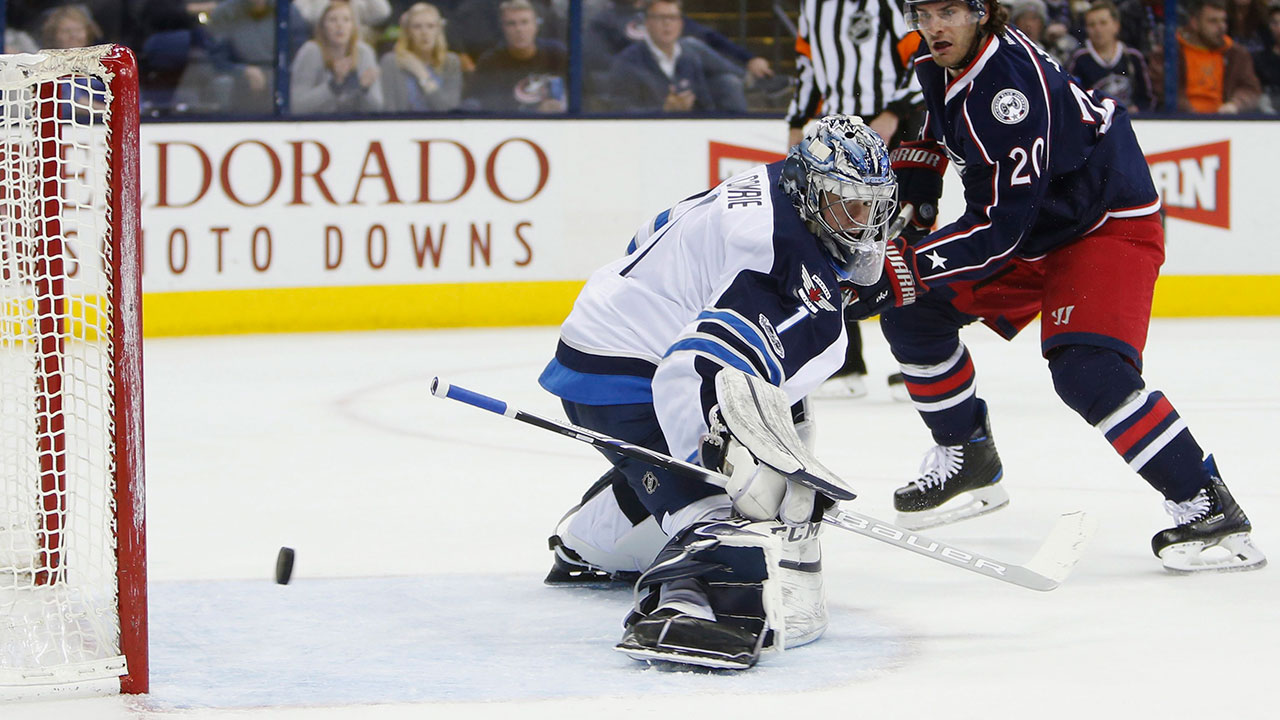 Eric Comrie makes 35 saves in NHL debut as Jets beat Blue Jackets