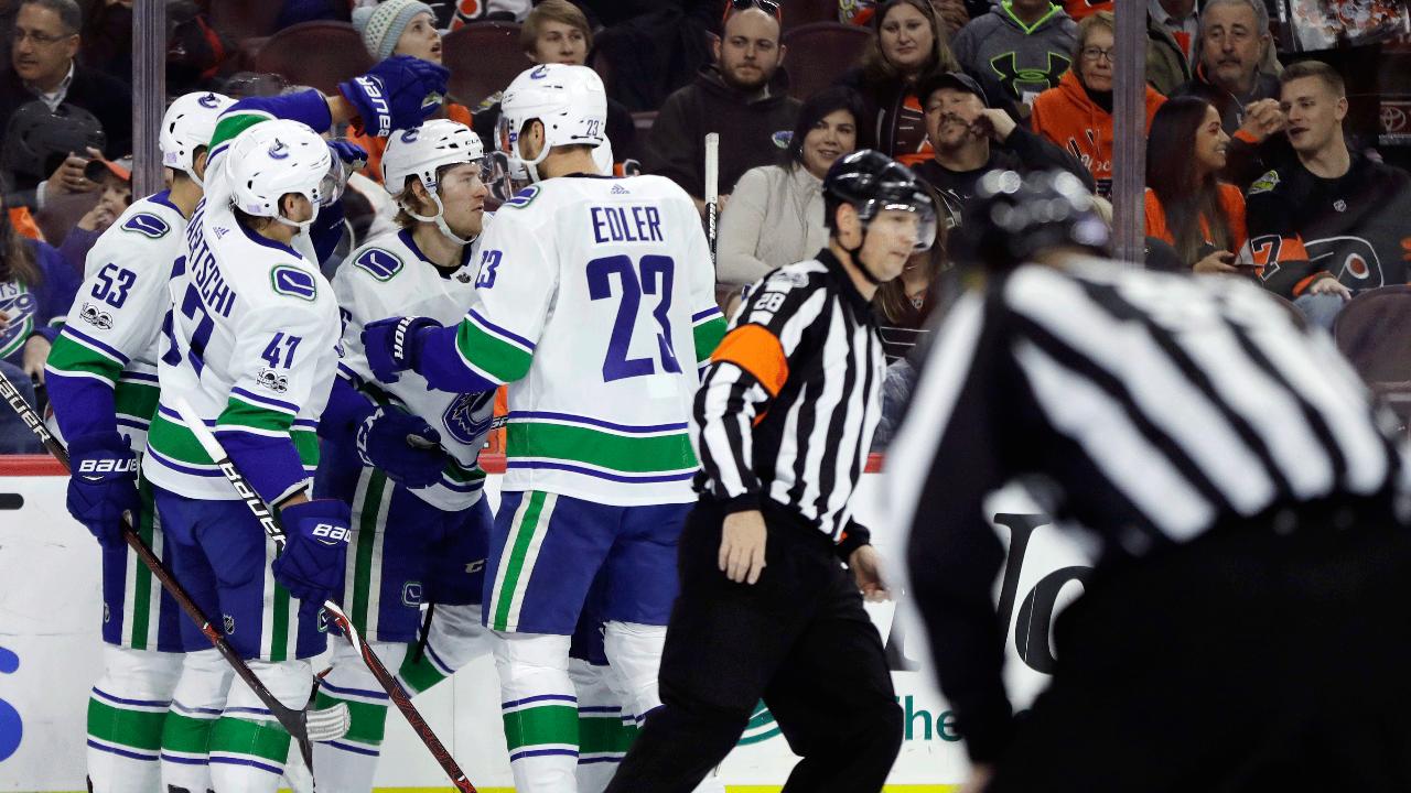 Boeser scores twice, Canucks beat skidding Flyers