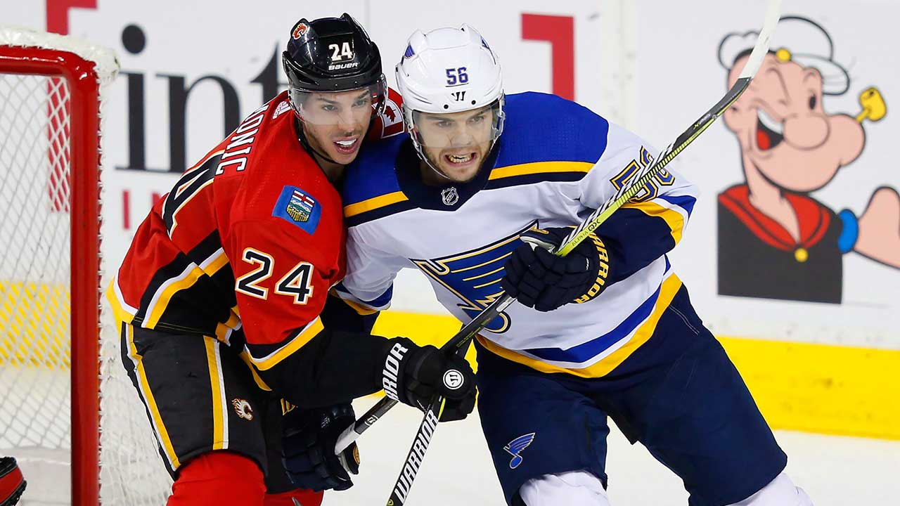 Flames place Travis Hamonic on IR, recall Rasmus Andersson