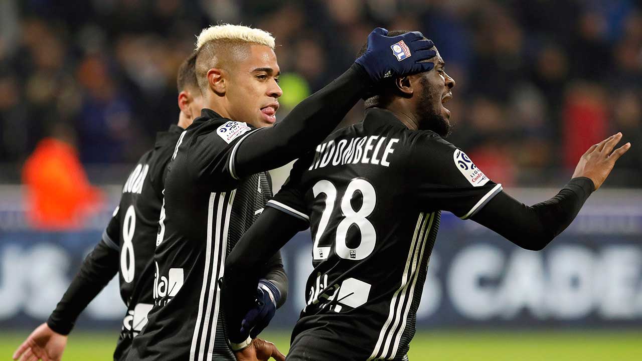 Lyon withstands late onslaught to beat Caen