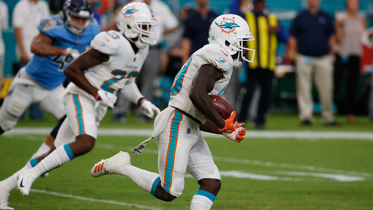 Dolphins overcome 2 lightning delays to beat Titans