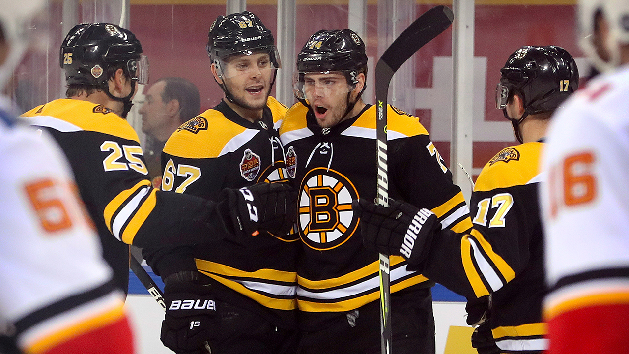Jake DeBrusk scores twice as Bruins beat Flames in China