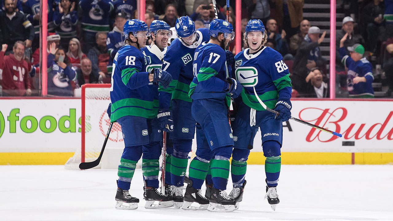 Canucks grab lead in Pacific Division with win over Sharks