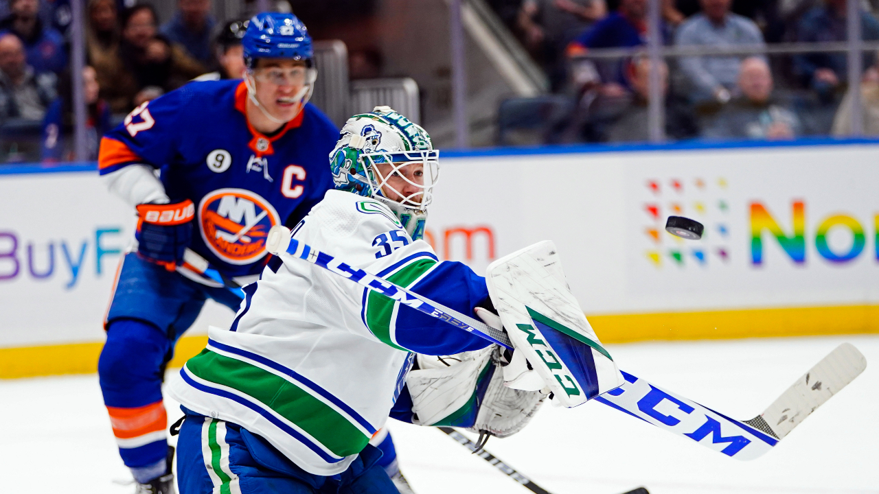 Canucks score twice early in third, rally past Islanders - Sportsnet.ca