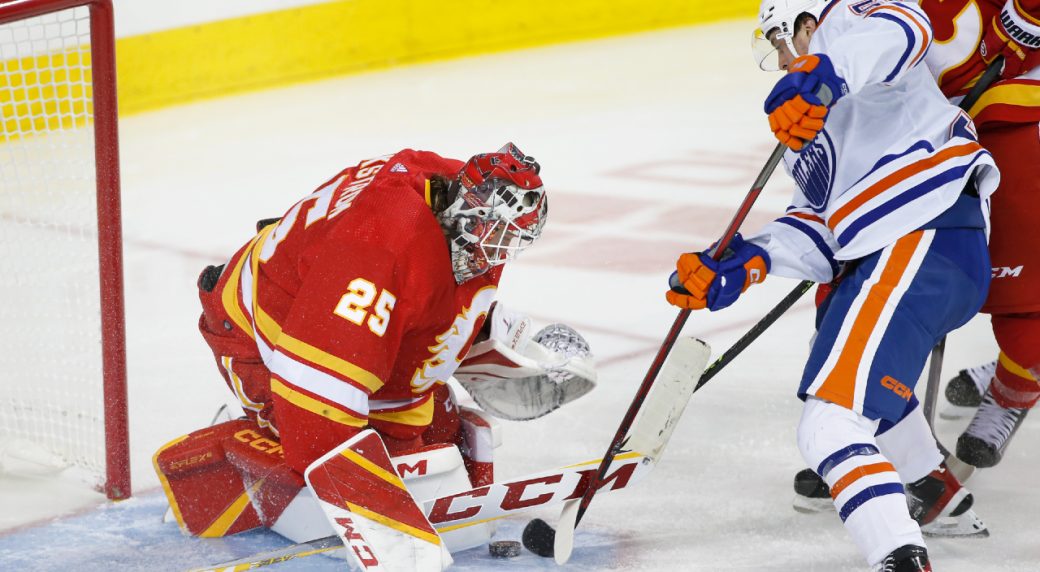 Flames burned at home by Oilers comeback