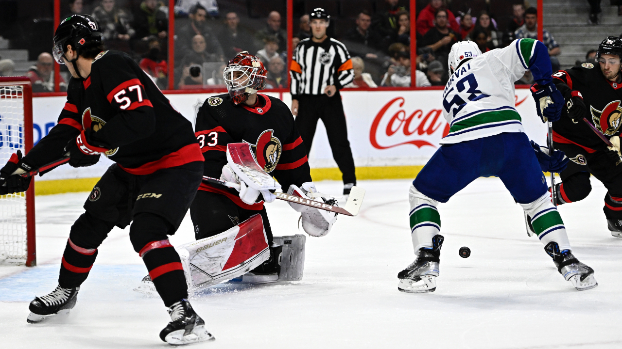 Canucks score four in third period, open road trip with win over ...