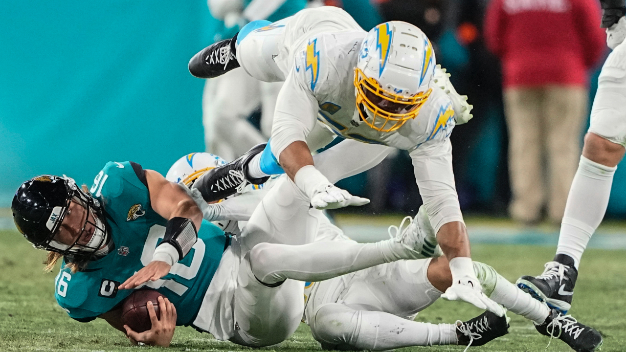 Jaguars' Lawrence makes NFL playoff history with four first-half picks ...