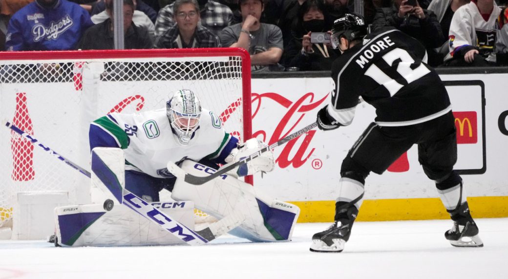 Kings score four unanswered goals, clinch playoff spot, in win over Canucks