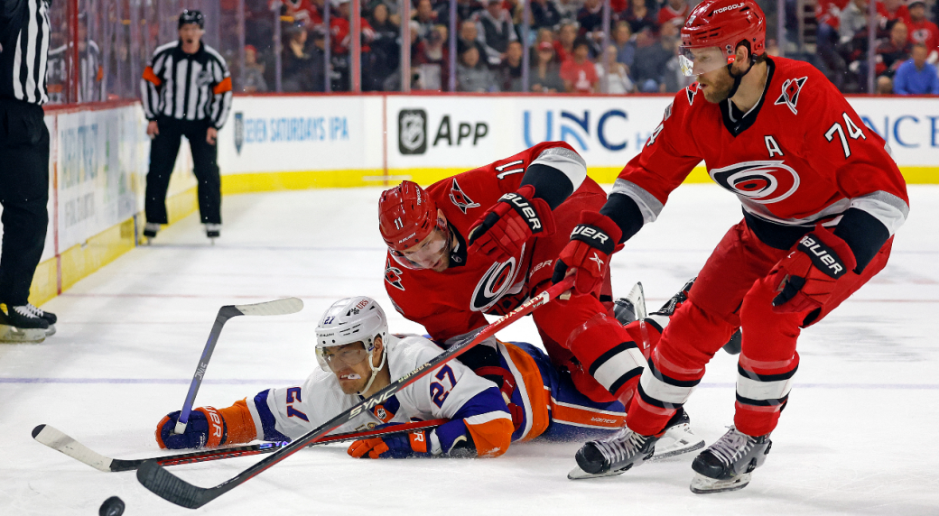 Islanders score off Aho's face, keep playoff hopes alive with tight win ...