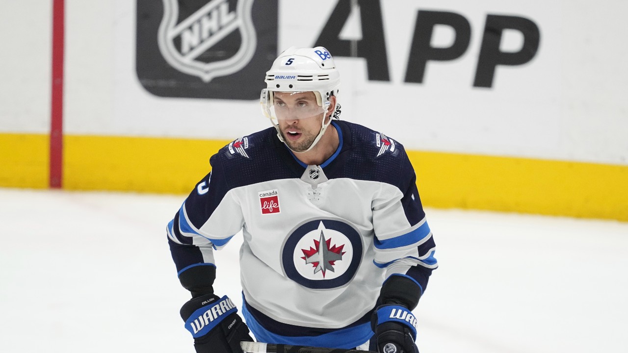 Jets' Brenden Dillon races off ice with hand injury after loss ...