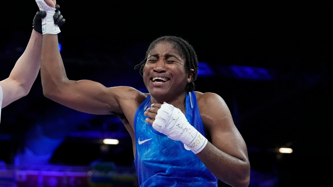 Boxer becomes first member of Refugee Olympic Team to clinch medal ...