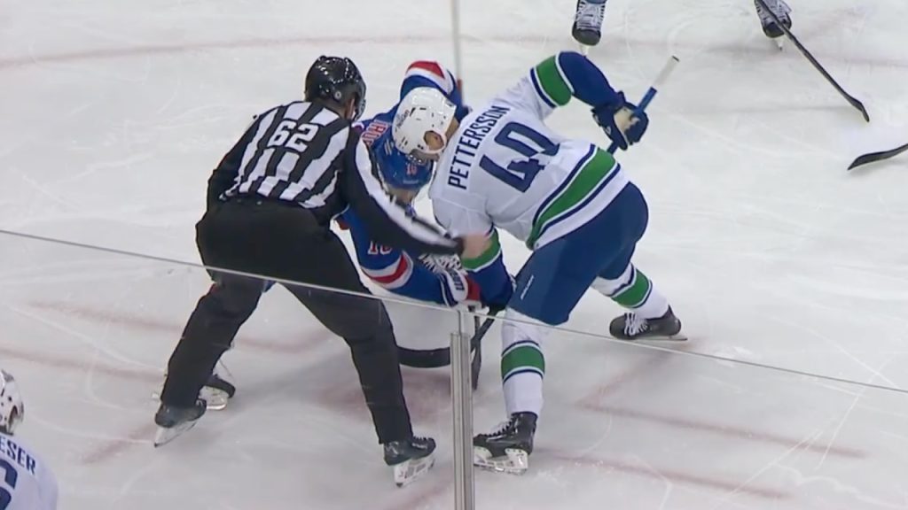 Canucks’ Pettersson heads down tunnel after apparent injury from faceoff