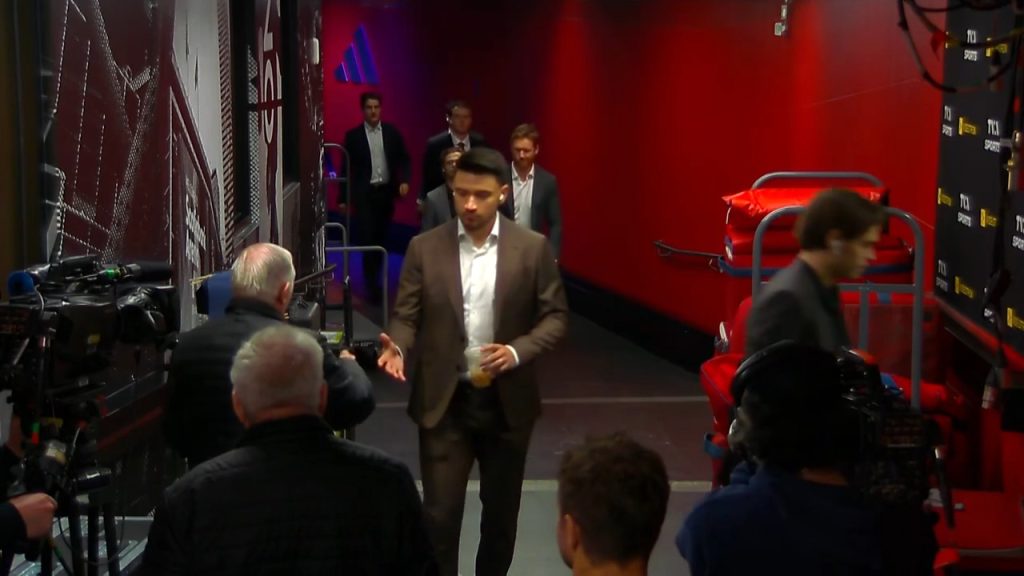 Nick Suzuki greets arena staff before opening night in Toronto